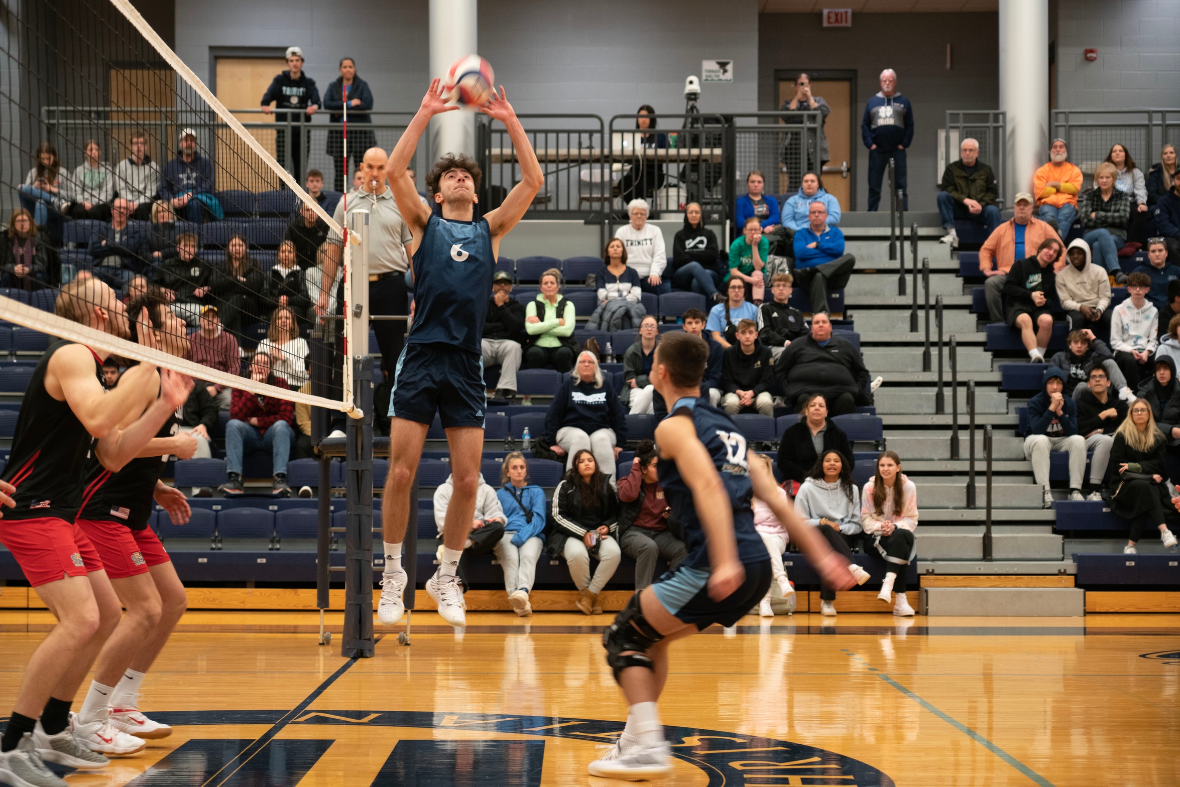 Trolls take straight-set win at Roosevelt - Trinity Christian College